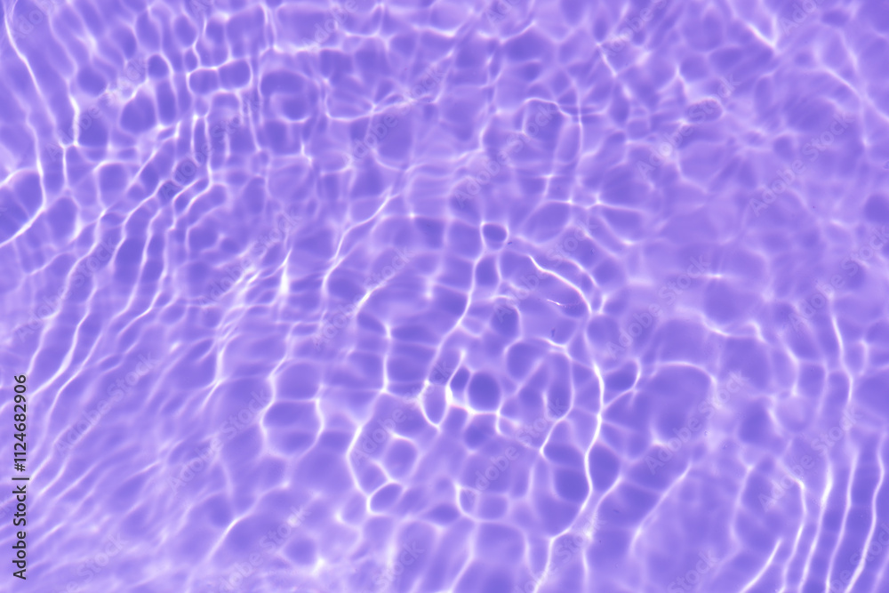 Purple water bubbles on the surface ripples. Defocus blurred ...