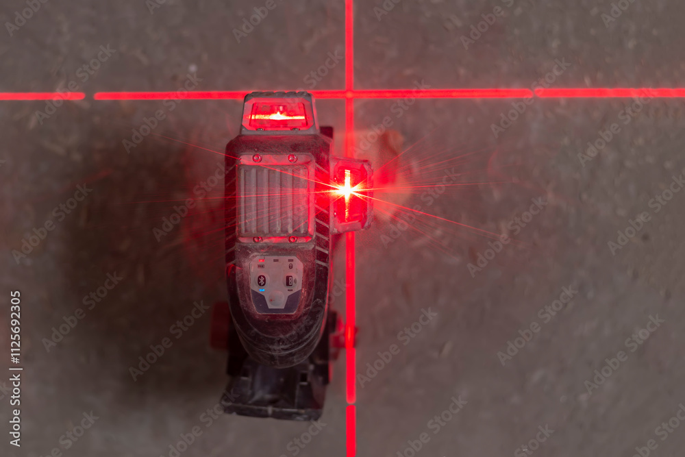 Laser level for setting the exact level at construction site.Modern ...