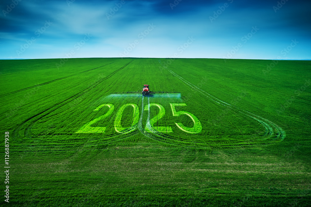 2025 Happy New Year concept and Aerial view of farming tractor plowing ...