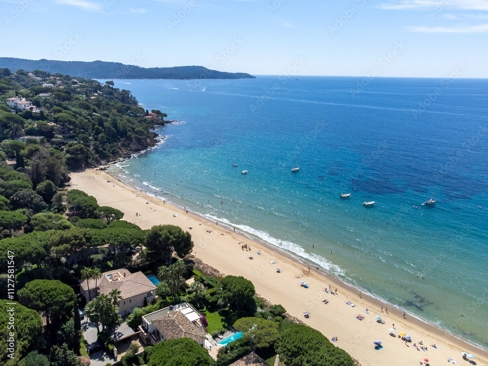 Aerial view on boats, crystal clear blue water of Plage du Debarquement ...