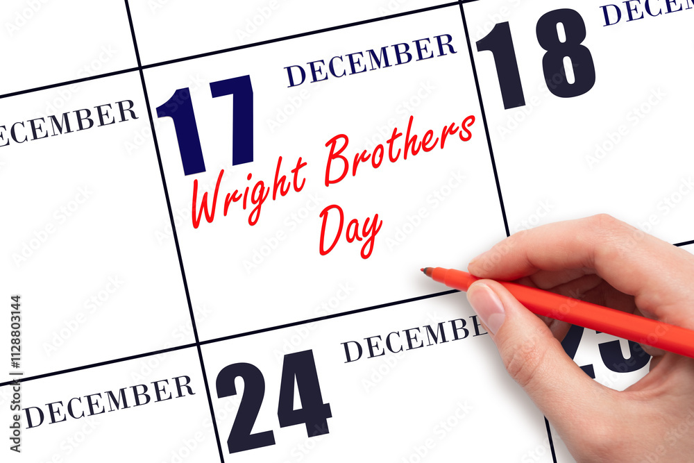 December 17. Hand writing text Wright Brothers Day on calendar date ...