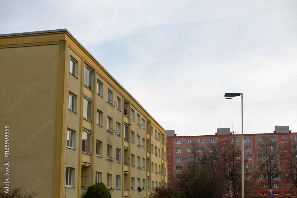 An impressive large apartment building stands prominently with a street ...