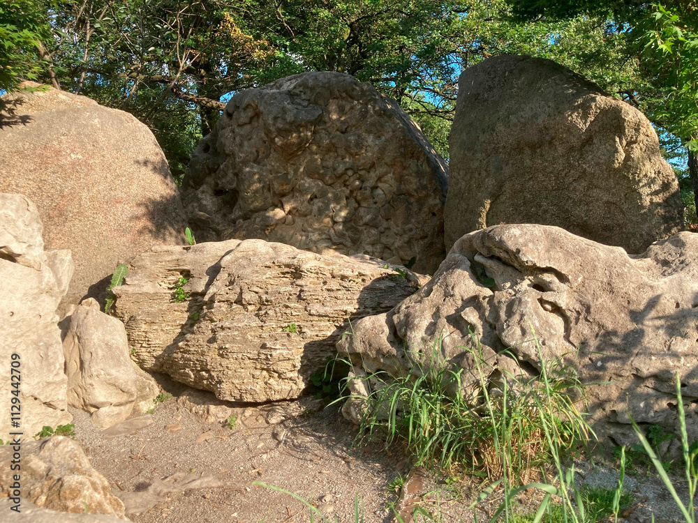 An outdoor archaeological site with a weathered, possibly human-made ...