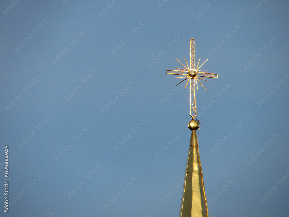 Image of a golden weather vane atop a possible church, with an arrow ...