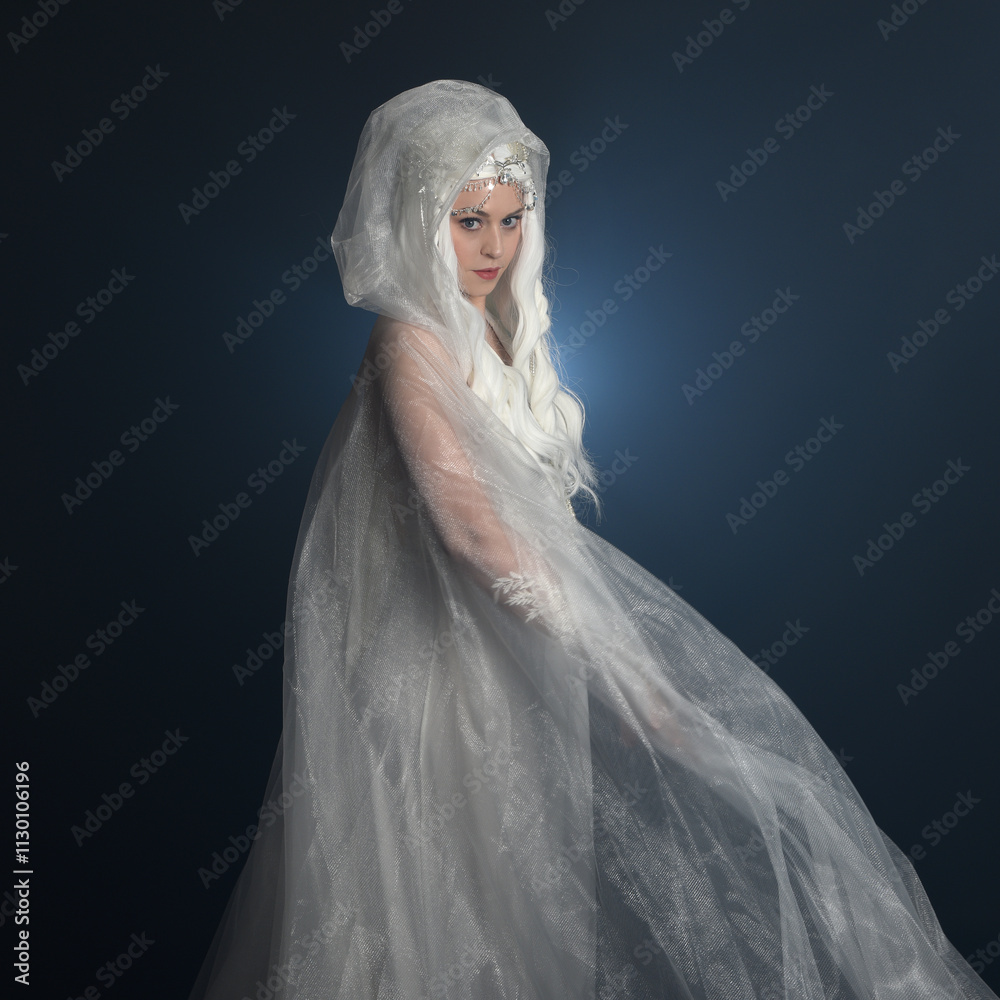 close up portrait of beautiful blonde female model wearing white ...