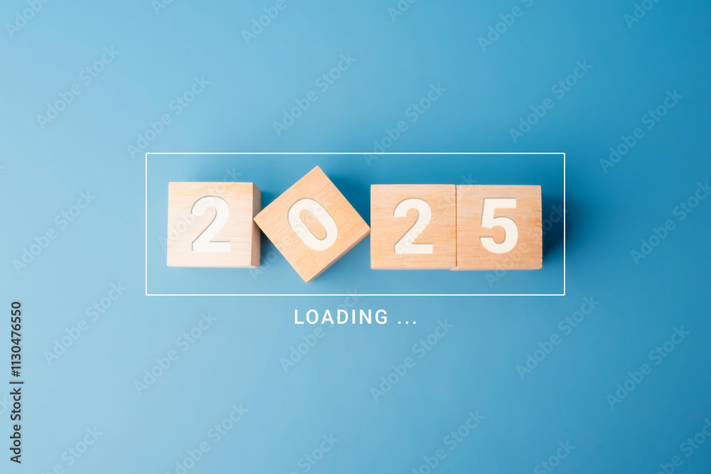 Loading bar with wooden block 2025 on blue background. Start new year ...