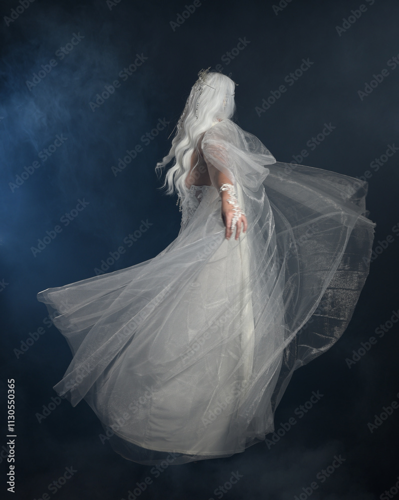 full length portrait of beautiful blonde female model wearing white ...