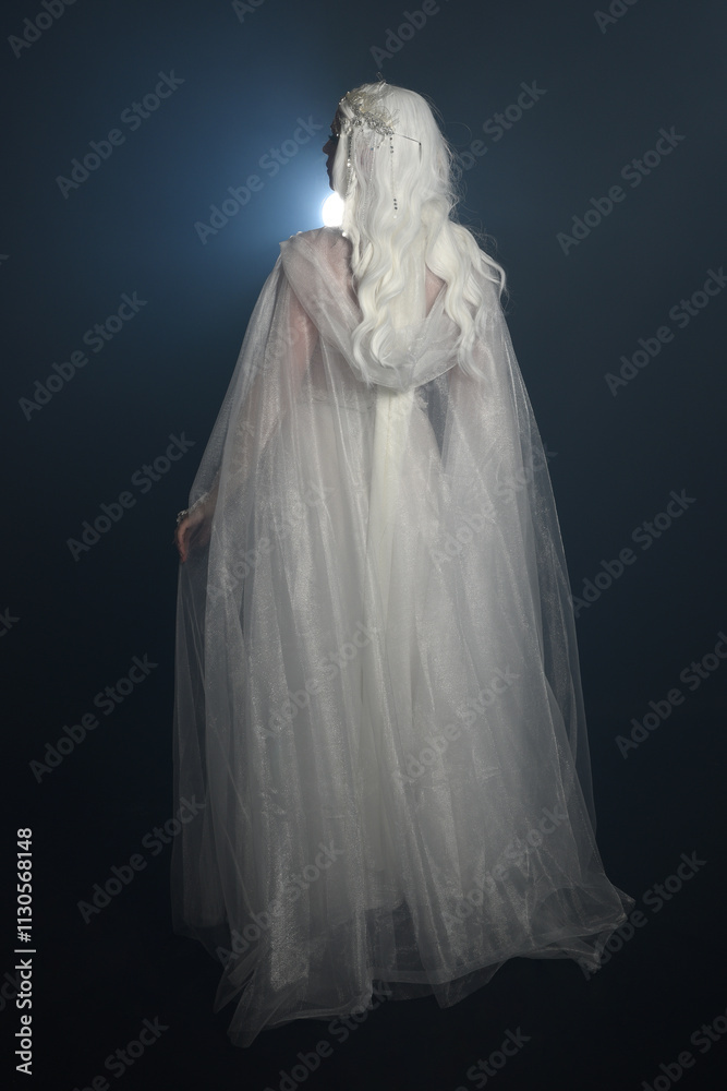 full length portrait of beautiful blonde female model wearing white ...