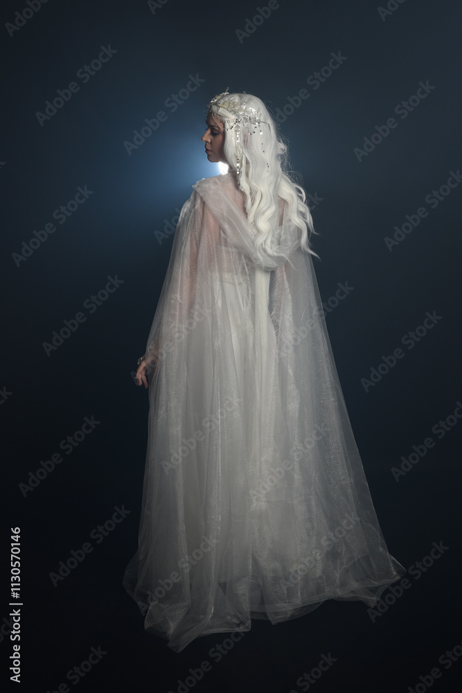 full length portrait of beautiful blonde female model wearing white ...