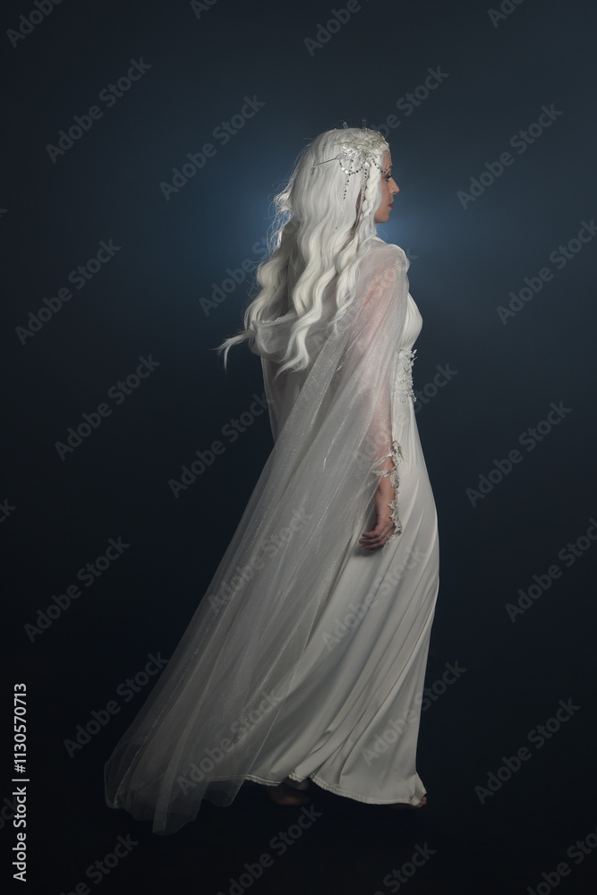 full length portrait of beautiful blonde female model wearing white ...
