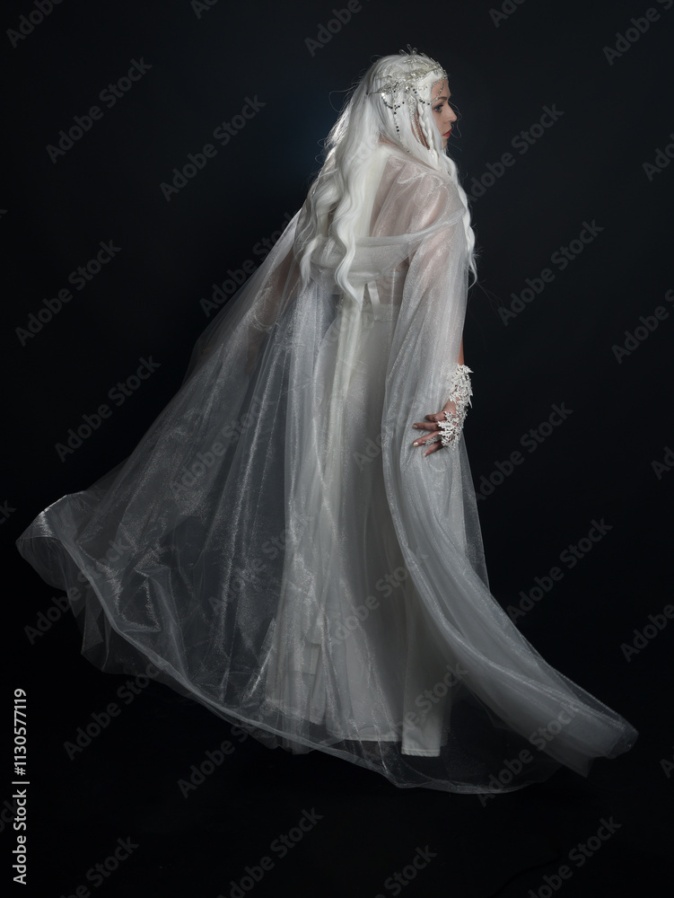full length portrait of beautiful blonde female model wearing white ...
