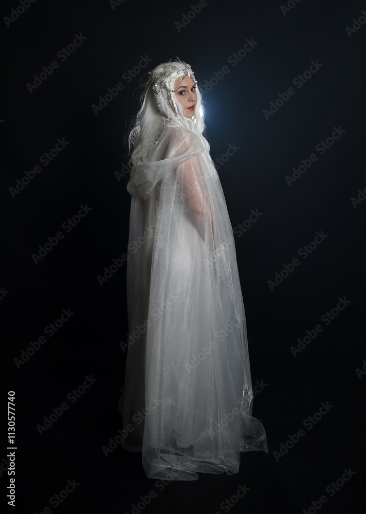 full length portrait of beautiful blonde female model wearing white ...