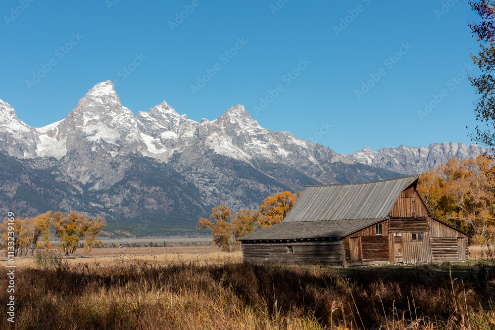 Abandoned barn in front of the Grand Teton mountain range Stock Photo ...