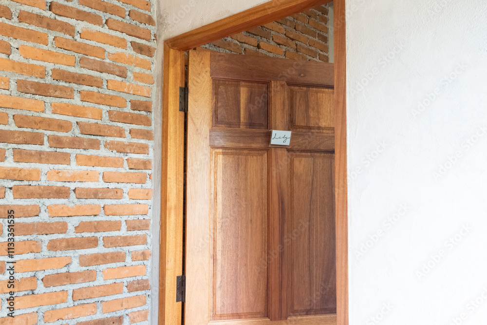 Wooden front door with Red brick wall texture background,modern house ...