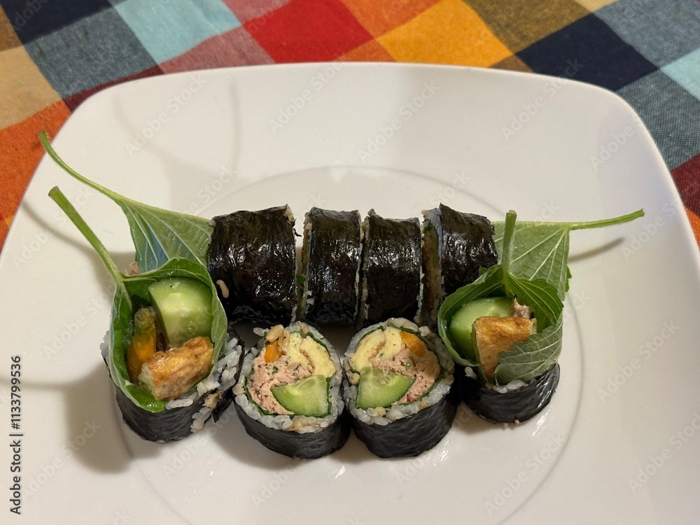 Delicious kimbap rolls filled with fresh vegetables, seasoned rice, and ...