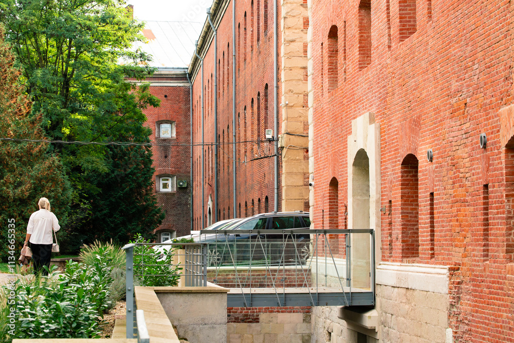 ordinary narrow back alley street brick wall building facade outdoor ...