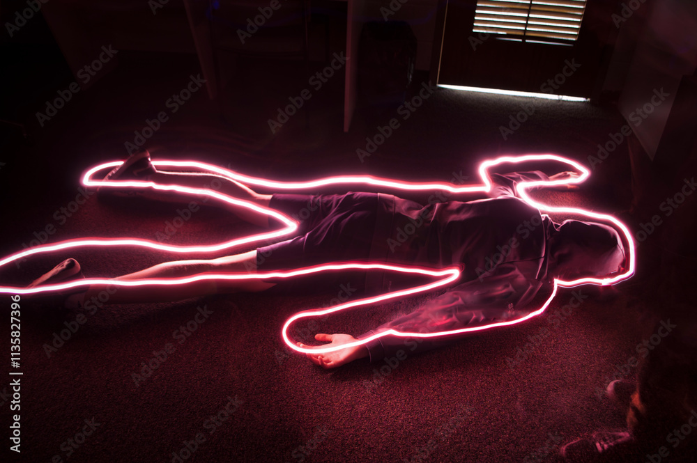Light painting of person dead lying on the floor highlighted and traced ...