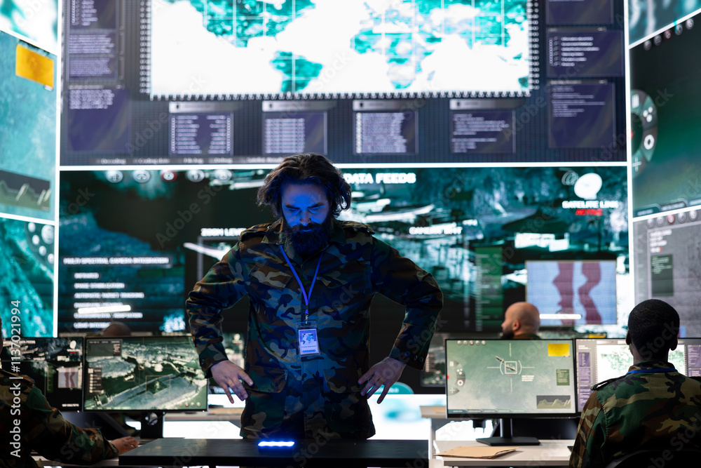 Army conscript examines satellite data on a hologram projection ...