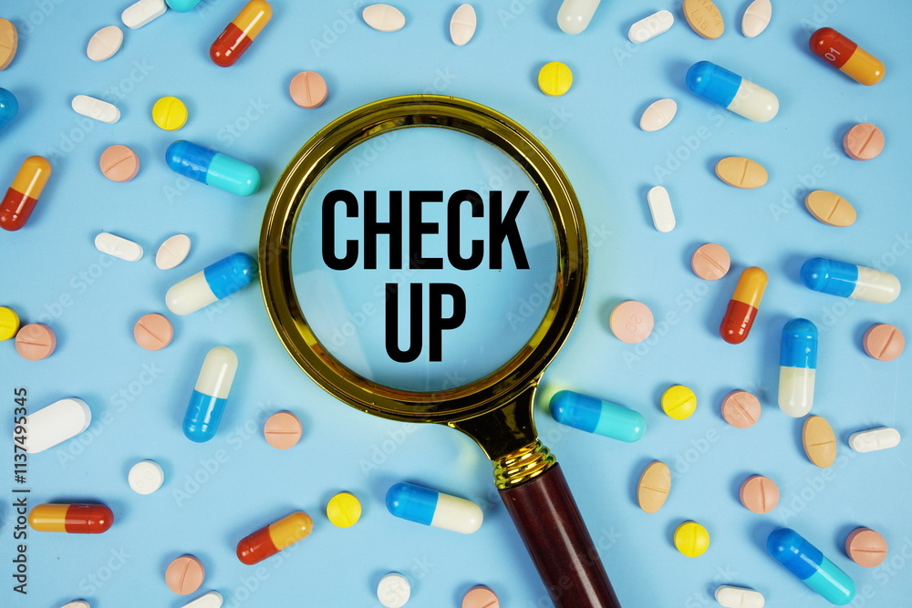 Check-up text on sticky note paper with Medicine and Maginfying glass ...