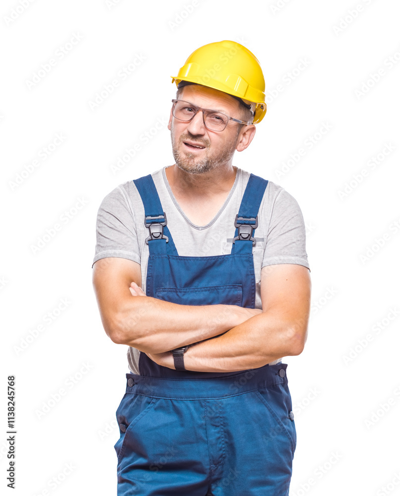 Doubtful and dissatisfied construction worker holding her arms crossed ...