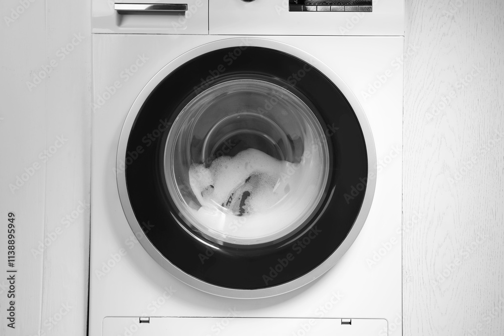 Washing machine with suds as background, closeup Stock Photo | Adobe Stock