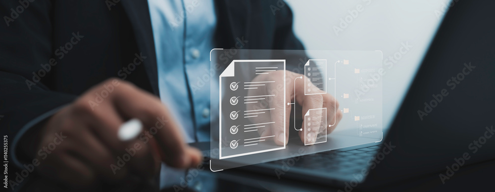 Businessman navigating a laptop with digital document management ...