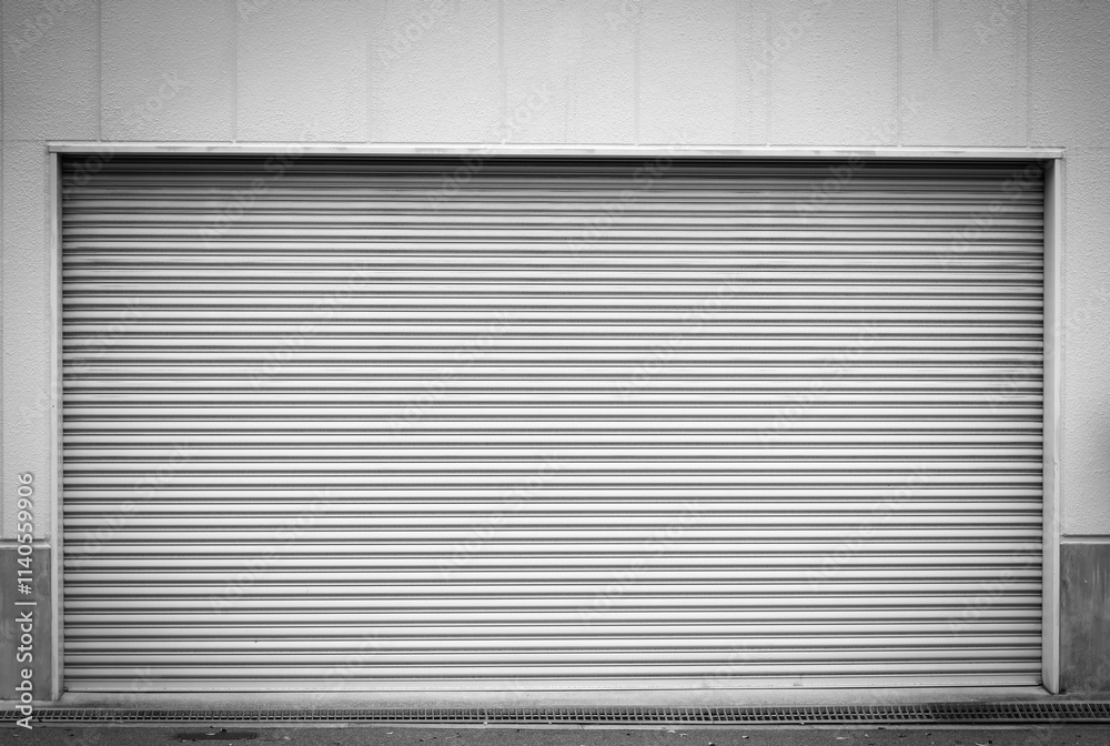 Closed steel shutter door of warehouse, storage or storefront for metal ...