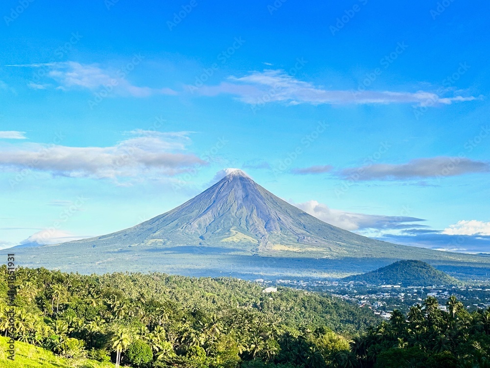 Beautiful and fresh air Mayon Volcano View with a green forest and blue ...