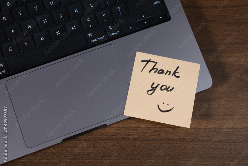 thank you note on laptop touchpad with smiley face for appreciation and ...