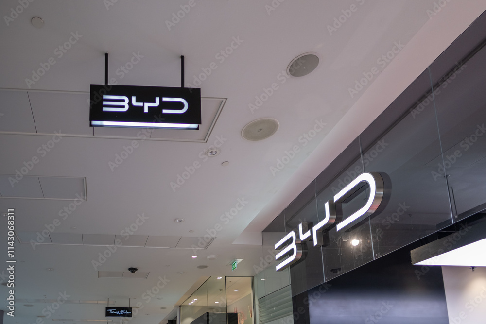 glowing Advertising banners BYD on black background, Chinese ...