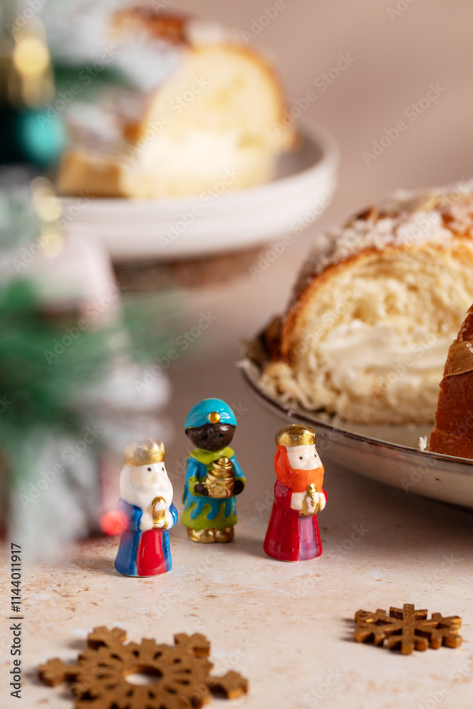 Card with traditional Three Kings Cake, three figurines of the kings in ...