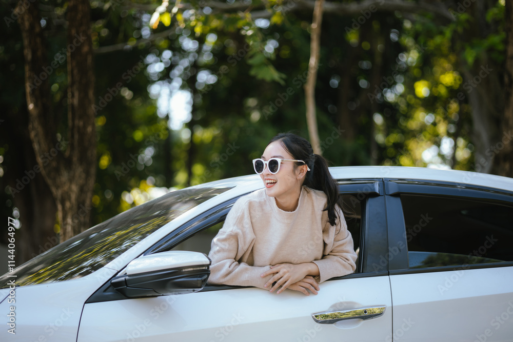Beautiful Asian girl traveling. The woman is smiling happily while ...
