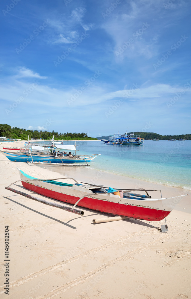 Bangka fishing boats on the beach of Inapupan Island in the Philippines ...