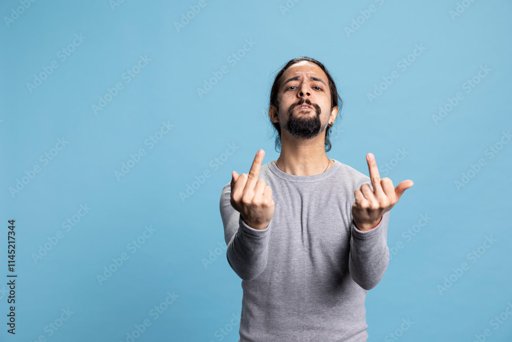 Offensive guy showing the middle finger in front of the camera and ...