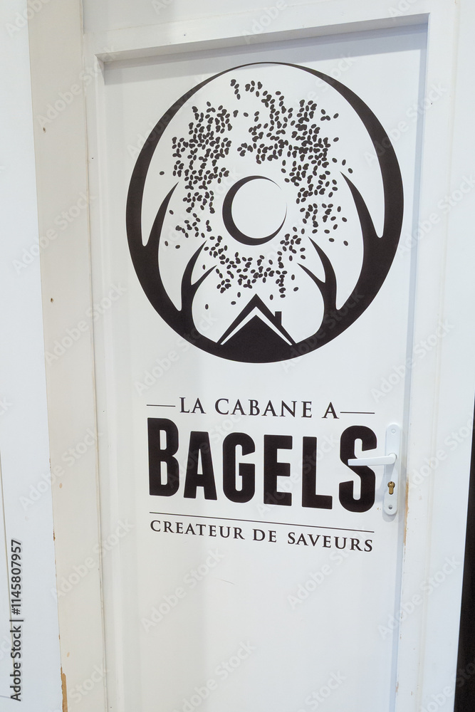 la cabane a bagels corner logo sign and brand text on windows facade ...