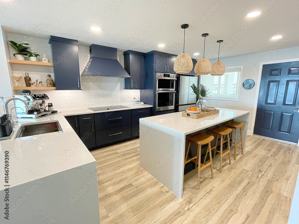 Newly remolded modern coastal kitchen with blue cabinets, white ...