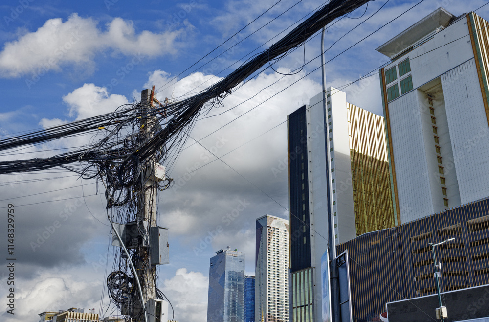 pylon covered with electric wires connected to new buildings in Phnom Penh, Cambodia Stock Photo ...