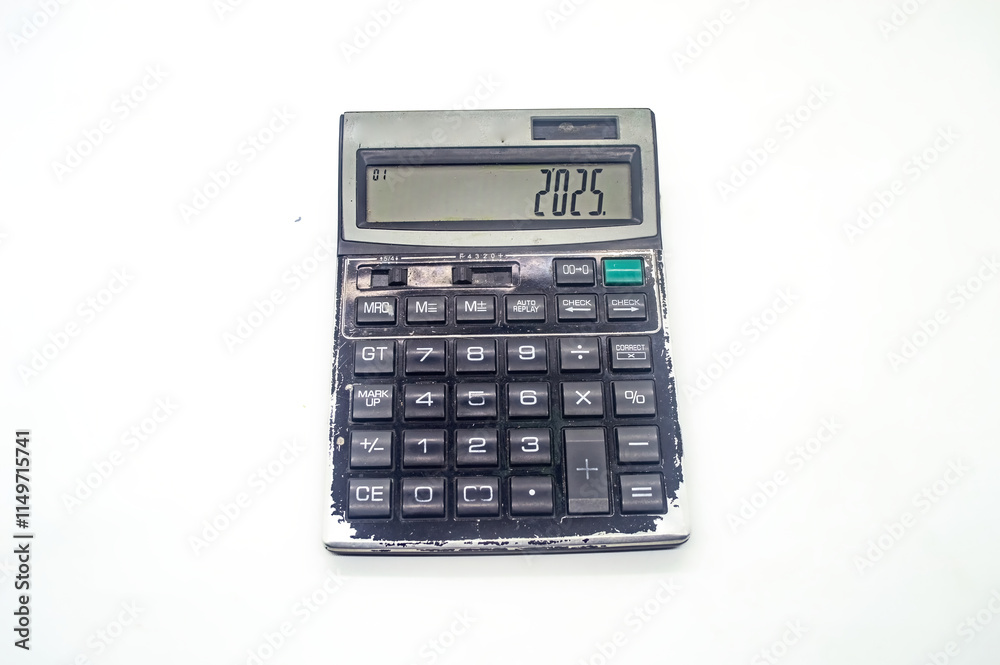 An old, worn out calculator displaying the number 2025 on its screen ...