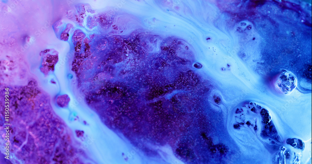 Ink leak. Shimmering current. Two jets liquid violet paint spill over ...