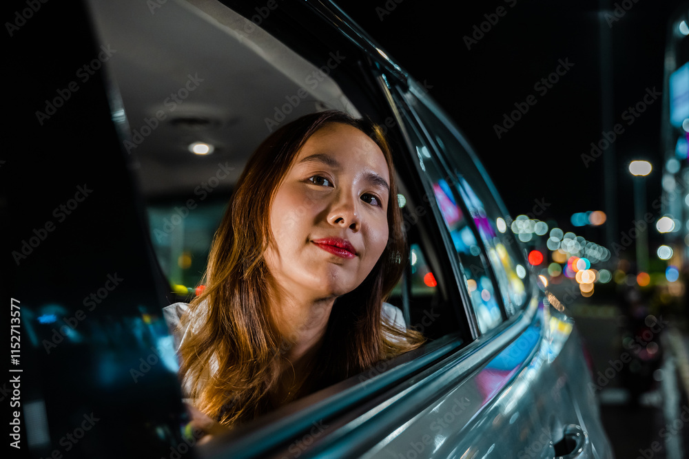 Sitting comfortably in a car, the woman observes the suburban and urban ...