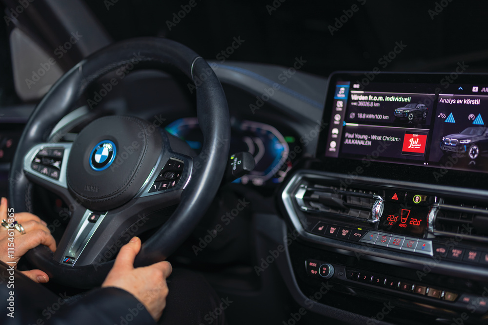 Interior of BMW iX3 electric car showing illuminated steering wheel ...