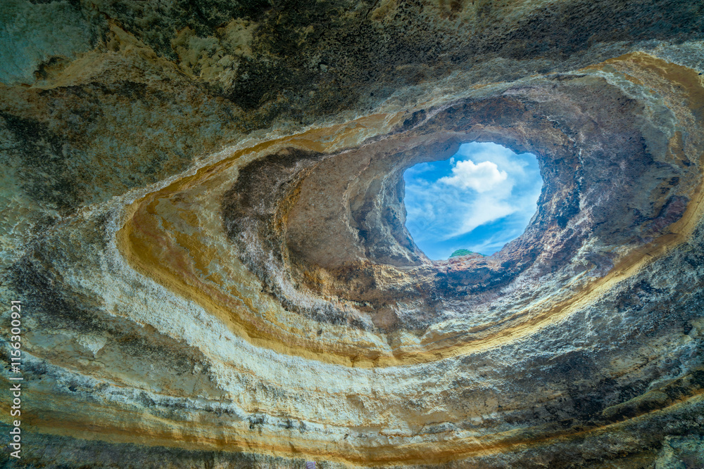 A heart-shaped skylight illuminates the interior of Benagil Cave, one ...