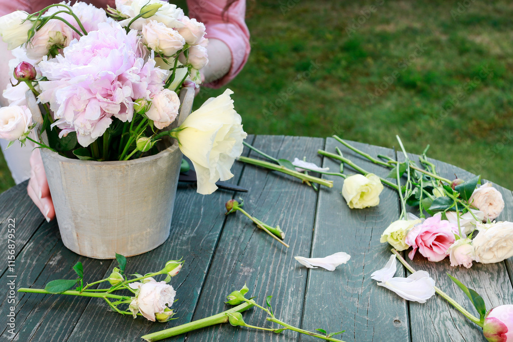 Florist at work: woman shows how to make a wedding garden party ...