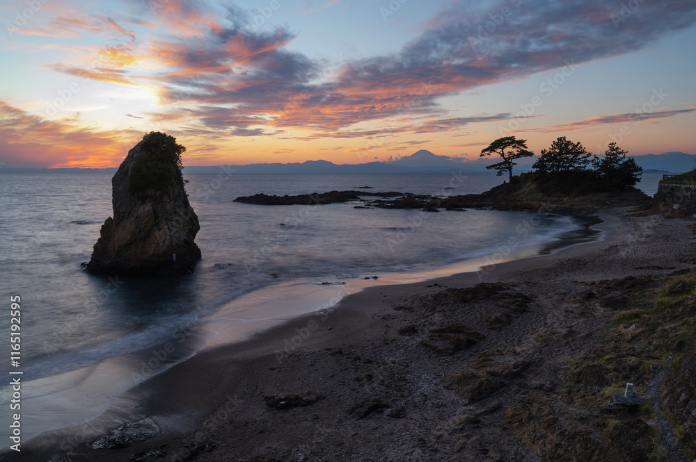 Blazing colorful sunset at Tateishi Park and its small beach cove and ...