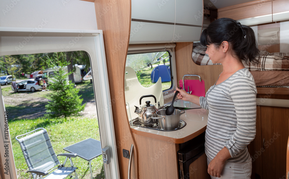 Woman cooking in camper, motorhome interior RV Stock Photo | Adobe Stock