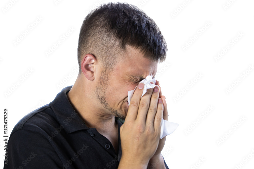A sick man in a black shirt sneezes into a handkerchief, tears ...
