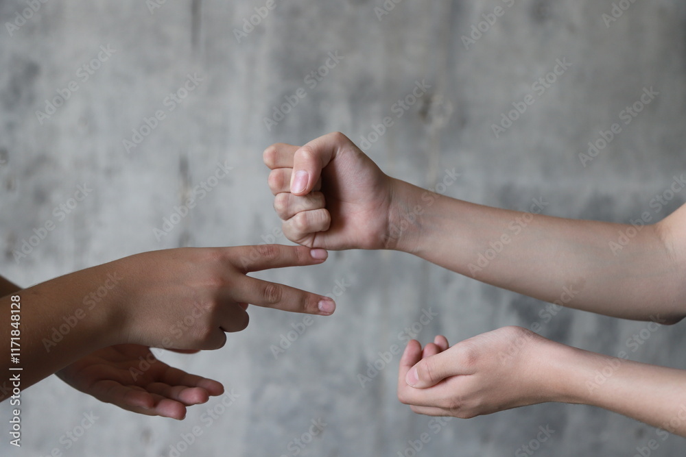 Kids playing rock paper scissors. Gray background with copy space ...