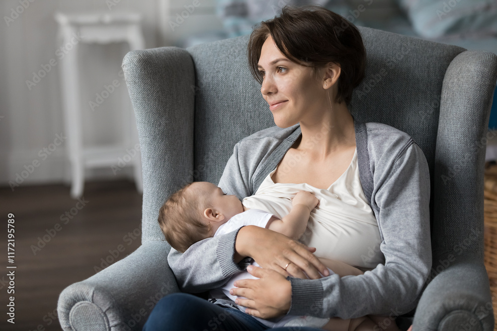 Candid moment. Dreamy loving young single mother relax in soft cozy ...
