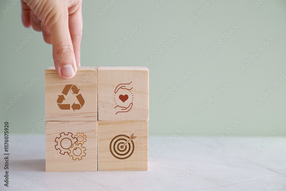 Hands holding wooden blocks with SDGs icons, Sustainable Development ...