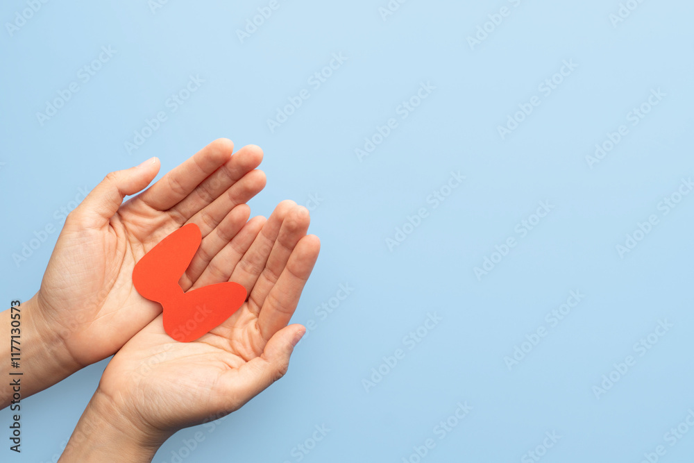 World Thyroid Day concept. Human hand holding thyroid gland shape made ...